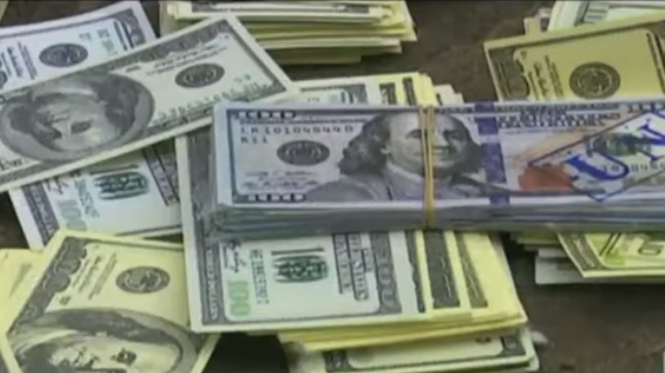 Millions of fake foreign currency found abandoned along busy city road ...